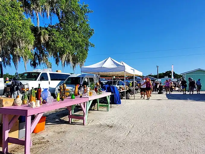 The outdoor marketplace buzzes with activity as colorful tents create a patchwork of possibilities beneath Florida's signature blue sky.