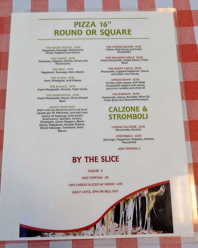 The menu reads like a love letter to pizza traditionalists – no kale or sriracha in sight, just honest-to-goodness classics done right. 