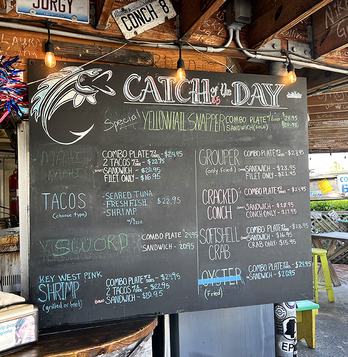 The chalkboard menu reads like poetry to seafood lovers – grouper, conch, and yellowtail snapper starring in this daily culinary drama.