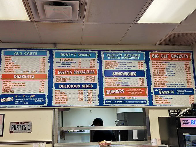 The menu board at Rusty's is like a treasure map for the hungry—X marks the spot for everything from clam strips to buffalo chicken.