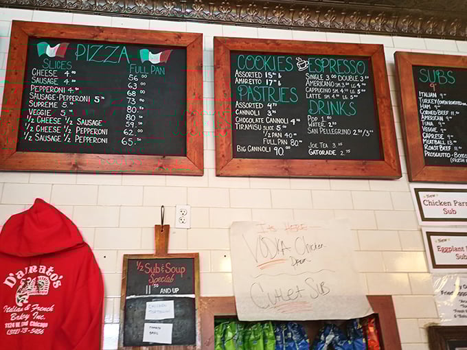 That menu board tells you everything you need to know about priorities here. Pizza, cookies, cannoli – the holy trinity of Italian comfort food.
