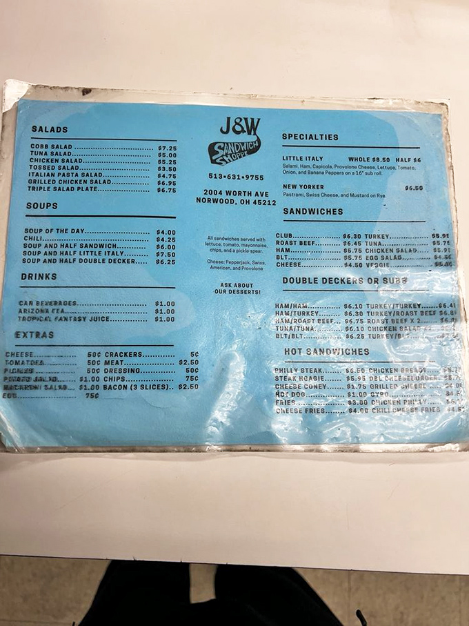 This well-worn menu tells the story of sandwich perfection—no fancy descriptions needed when the food speaks this eloquently.