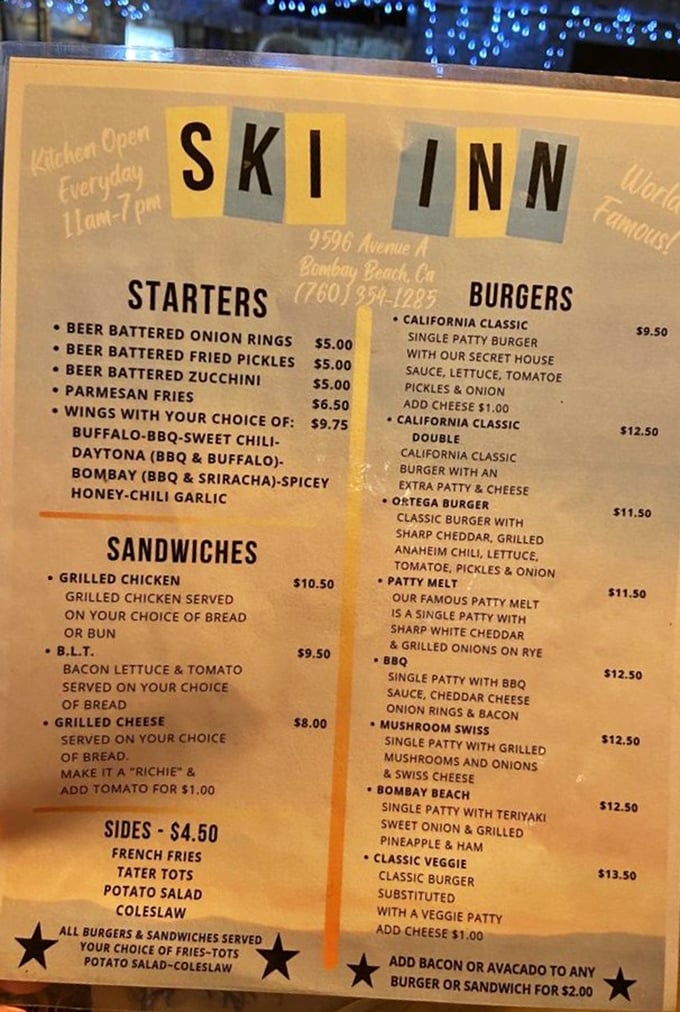 This isn't just a menu—it's a roadmap to happiness. The Bombay Beach burger with teriyaki and pineapple calls my name.