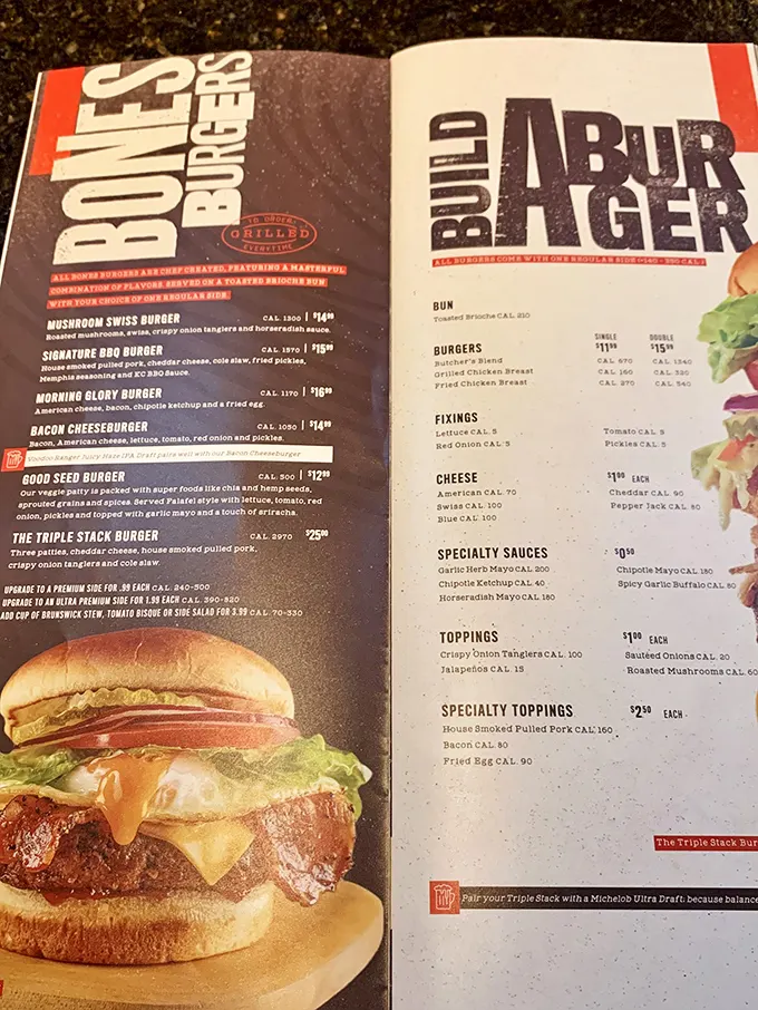 A menu that doesn't just list food—it tells delicious stories. The Triple Stack Burger with pulled pork is basically a meat skyscraper with architectural integrity.