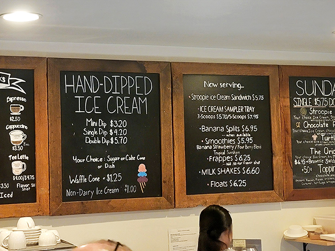 This menu board isn't just listing options—it's offering life choices. The hand-lettered chalk practically whispers, "Diet tomorrow, indulge today."
