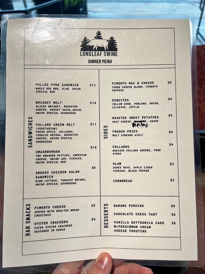 This menu reads like barbecue poetry – pulled pork, brisket melts, and banana pudding forming a holy trinity of Southern comfort.