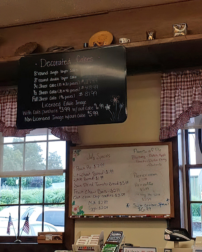 The menu board—a handwritten masterpiece that might as well say "Abandon diets, all ye who enter here"—showcases specialties from pies to breads.