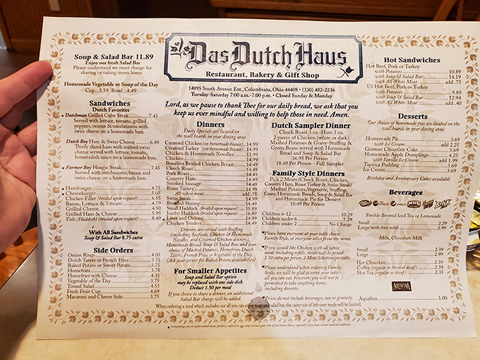 A menu that reads like a love letter to comfort food. The prayer at the center reminds you this isn't fast food—it's food with tradition.