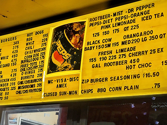 The yellow menu board—a beacon of hope for the hungry. No fancy fonts needed when the food speaks this loudly.