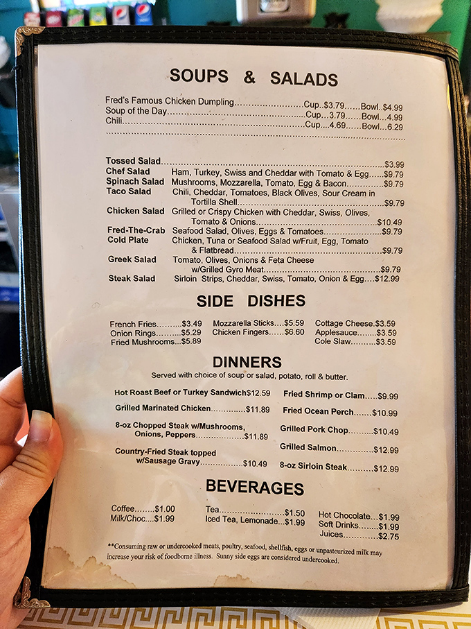 A menu that doesn't need fancy fonts or pretentious descriptions – just honest food at honest prices. The "Fred-The-Crab" salad hints at unexpected treasures.