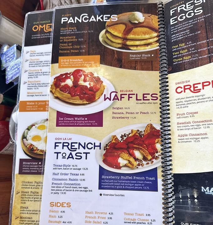 Breakfast paradise captured in spiral-bound glory. Those strawberry-topped Belgian waffles aren't just photographed—they're immortalized.
