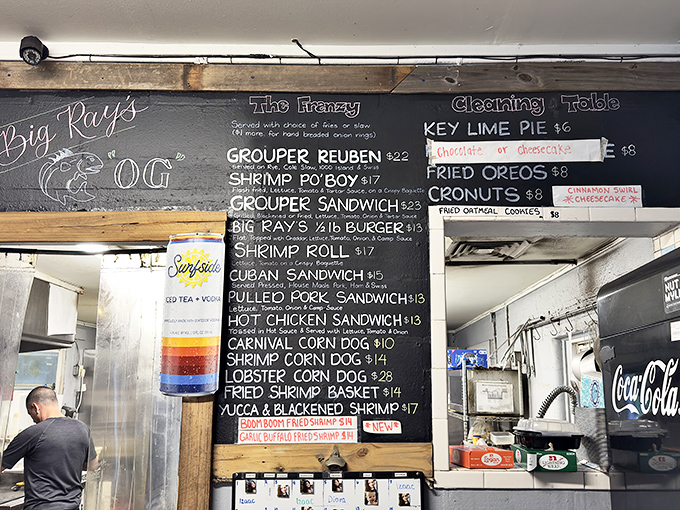 Chalkboard menus: where culinary dreams are written in dust. The Grouper Reuben beckons, while Lobster Corn Dogs whisper sweet temptations.