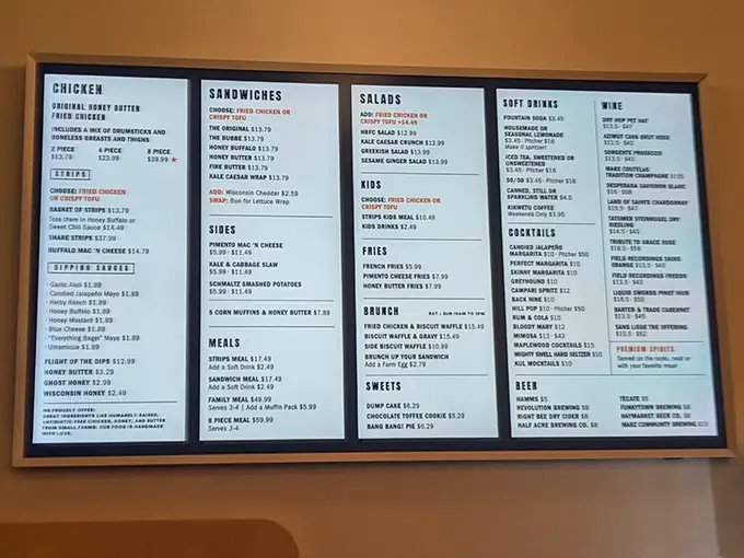 The menu board – a roadmap to happiness. Each item carefully curated, proving that sometimes the best restaurants don't need encyclopedic offerings.