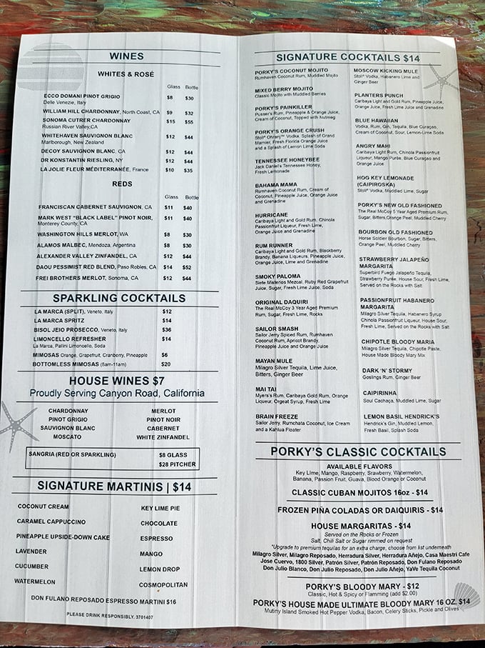 A cocktail menu that reads like a Caribbean novel—each drink promising its own little adventure. The Porky's Painkiller might be medicinal, but I'm not asking for a prescription.