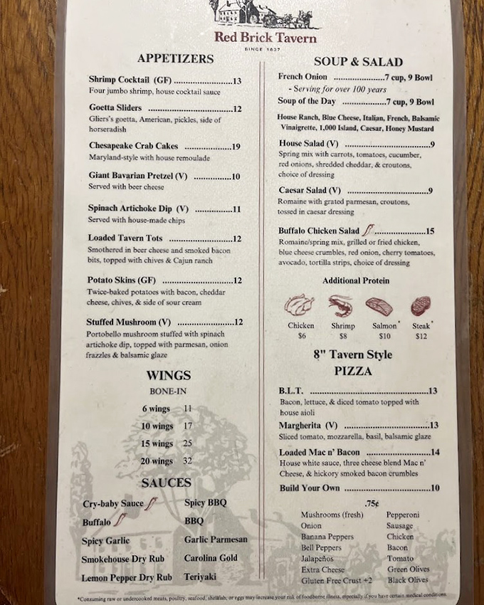 This isn't just a menu—it's a historical document. French onion soup "serving for over 100 years" isn't marketing; it's a delicious promise kept since the Teddy Roosevelt administration. 