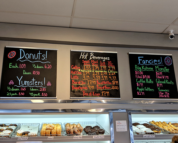 The chalkboard menu tells you everything you need to know about life's priorities: Donuts first, hot beverages second, and "Fancies" for when you're feeling adventurous.