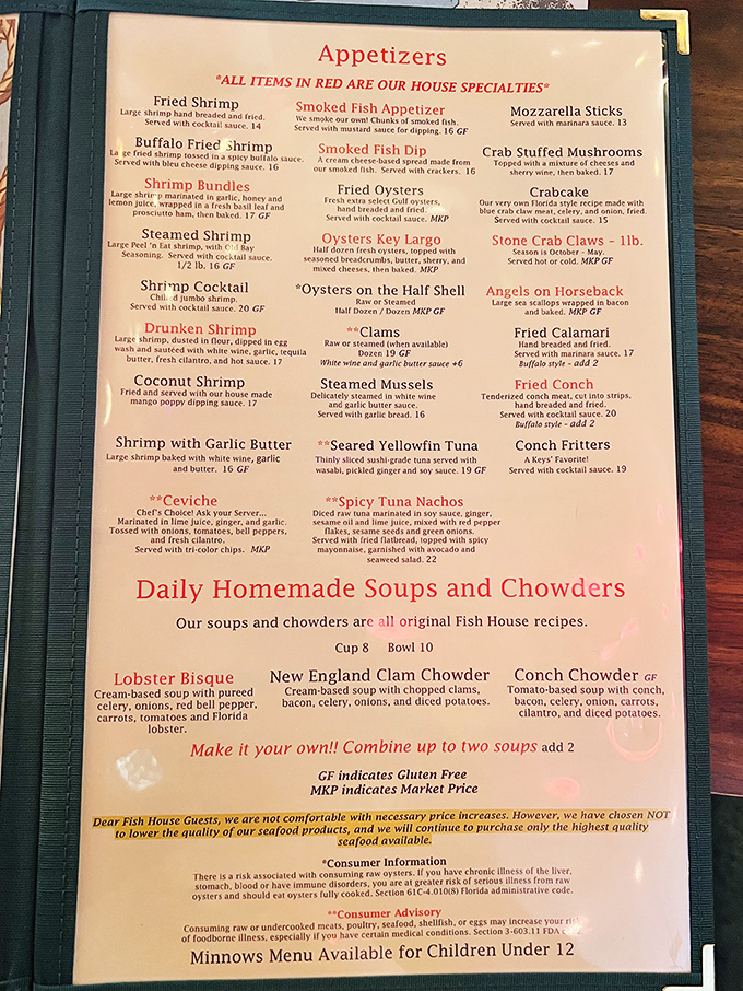 The menu reads like a love letter to seafood lovers. Red items are house specialties, and that lobster bisque is calling your name.