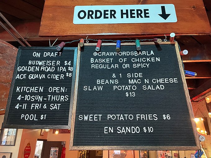 The letter board menu speaks the universal language of simplicity: chicken, sides, beer. No decoder ring required.