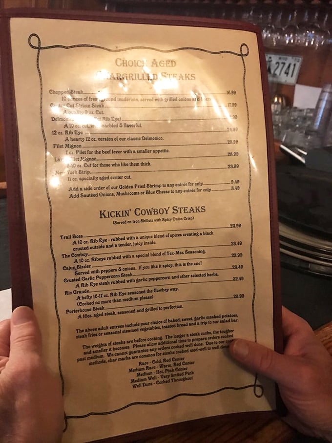This menu isn't just a list of options – it's a roadmap to carnivorous bliss. The "Kickin' Cowboy Steaks" section alone deserves a moment of silence.