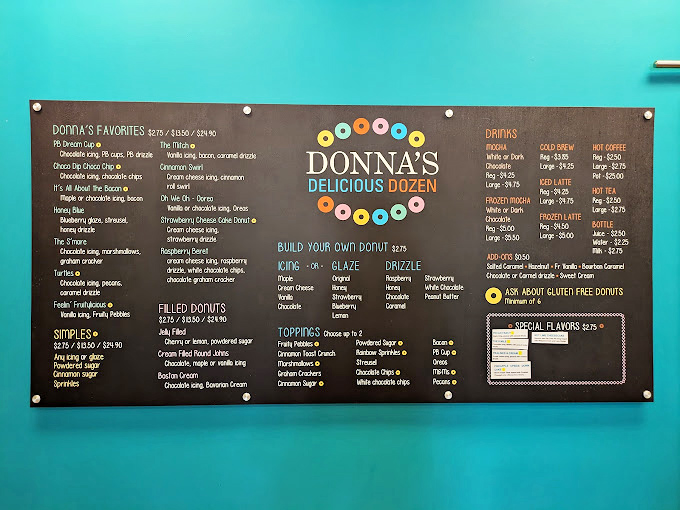 The menu board at Donna's isn't just a list – it's a roadmap to happiness with colorful donut illustrations guiding your sweet journey.
