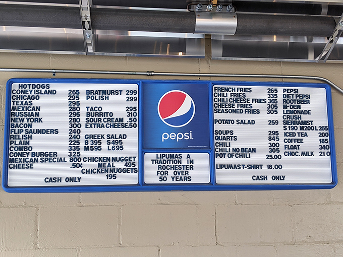 The menu board tells the whole delicious story—decades of hot dog artistry captured in blue and white, with that "Cash Only" reminder of simpler times.