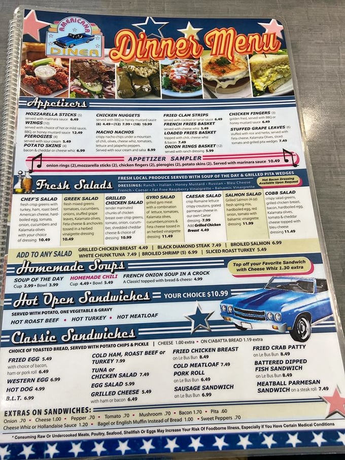The menu reads like a love letter to American comfort food – spiral-bound nostalgia offering everything from loaded fries to hot open sandwiches.