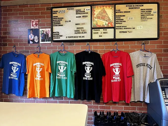 The menu board and colorful t-shirt display tell you everything you need to know—this place has loyal fans and hasn't needed to change its winning formula in decades.