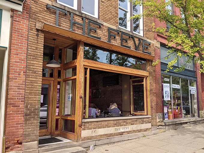 The Feve's wooden storefront promises comfort food with a PhD—simple dishes that somehow know more than you do about flavor.