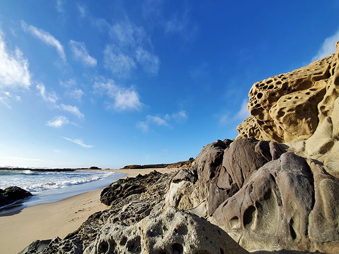 Honeycomb sandstone formations that look like Mother Nature's attempt at Swiss cheese—millions of years in the making.