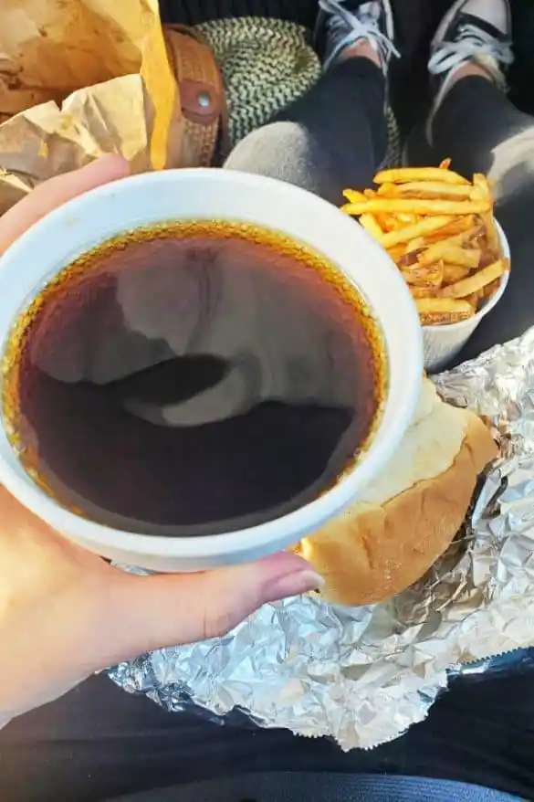 Liquid happiness in a white mug! The homemade root beer's deep amber color promises a flavor symphony that makes commercial sodas seem like elevator music.