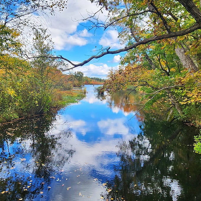 Fall's fashion show is in full swing along this waterway, where trees dress in their autumn best and the sky borrows the water's blue.