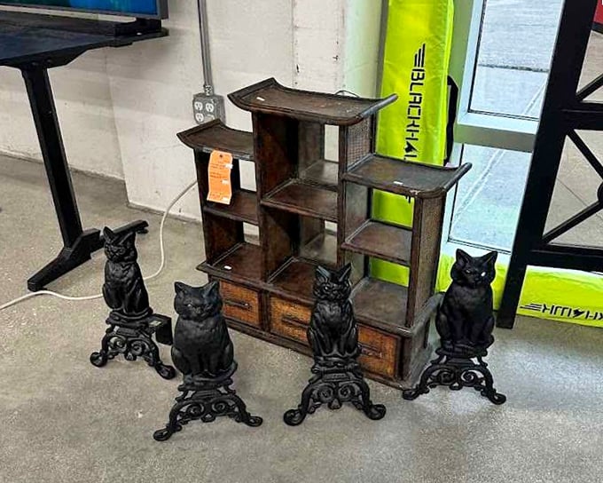 These dignified feline sentinels guard a vintage display shelf that's begging to become the conversation piece in someone's carefully curated apartment. Cat-tastic value!