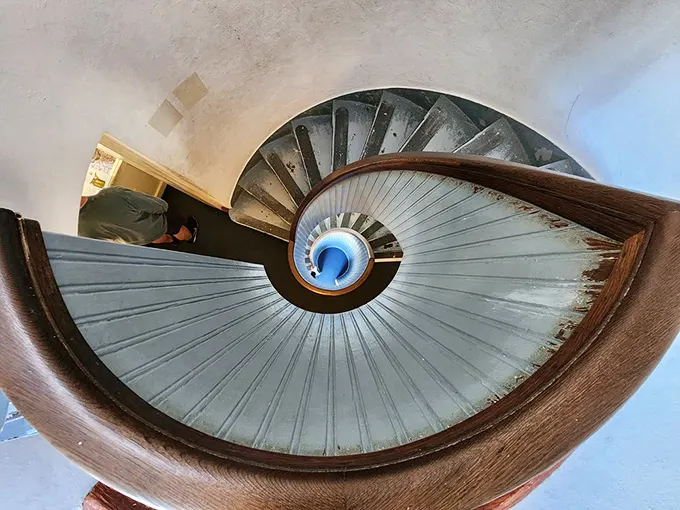 The lighthouse's spiral staircase is a dizzying masterpiece of 19th-century engineering. Lighthouse keepers climbed these steps nightly—the original StairMaster workout.