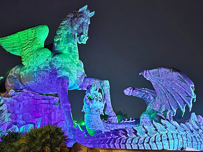 By night, the statue transforms into a technicolor dream, illuminated in hues that would make even Las Vegas blush.