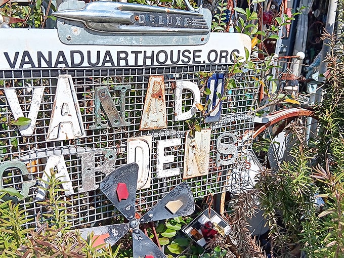 Even the website sign refuses conformity, with letters cobbled from car parts—the internet address that's also an art installation.