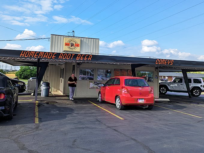 The Ashland-Wooster Drive-In doesn't whisper about its specialties – it announces "FIRE DOGS" and "FRIED PICKLES" like breaking news.