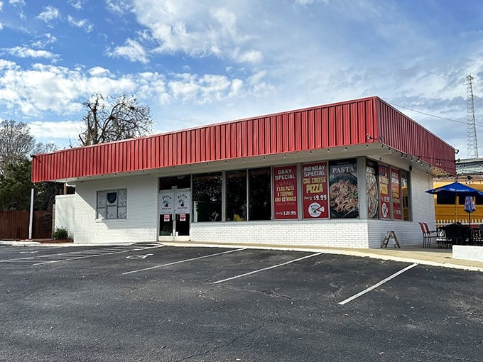 That bold red roof isn't compensating for anything—the pizza inside is every bit as confident and satisfying.