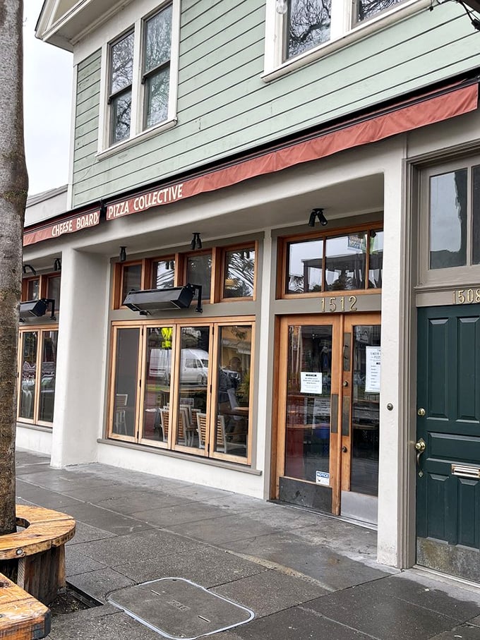 The Cheese Board's storefront promises pizza revolution in Berkeley. One type of pizza daily, and still the line stretches down Shattuck Avenue.