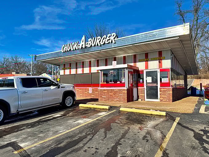 Chuck-A-Burger's red and white striped facade is like a time machine to the 1950s, complete with juicy burgers and nostalgic vibes.