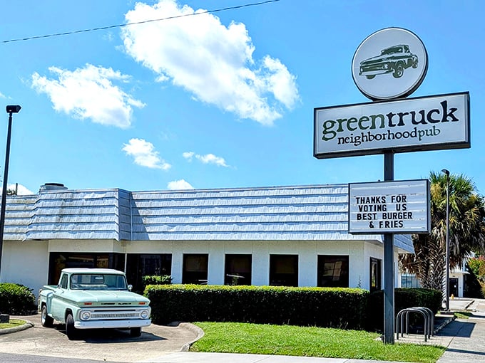 Green Truck Pub's charming exterior and vintage truck mascot – where farm-fresh meets comfort food in Savannah's hidden gem.