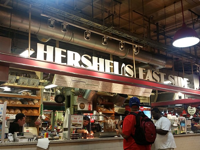 Hershel's glowing sign cuts through Reading Terminal Market's hustle like a hot knife through pastrami—impossible to miss, impossible to resist.