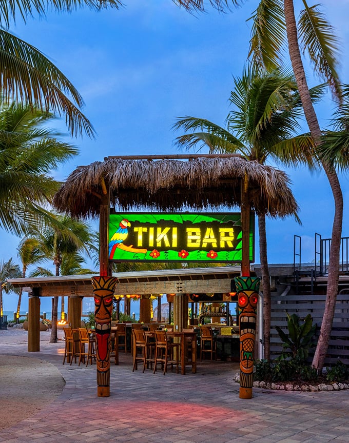Nothing says "I've made it to paradise" quite like a tiki bar glowing against palm trees at golden hour.