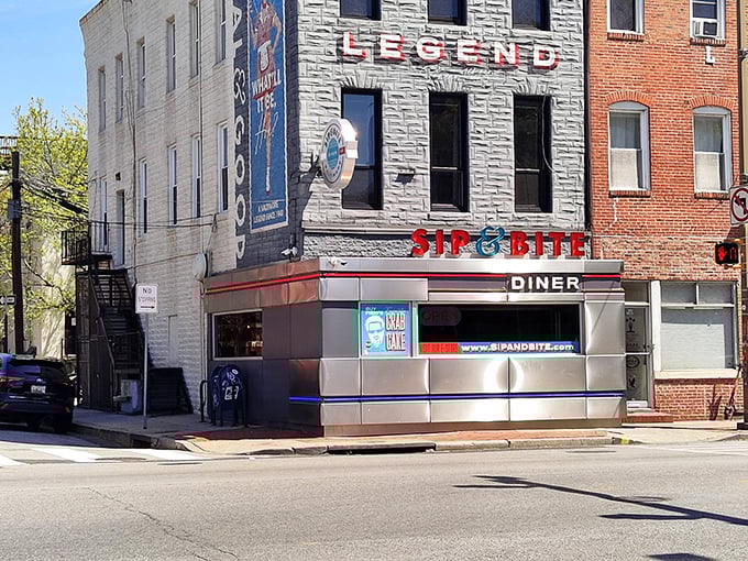 Sip & Bite (exterior): "Baltimore's legendary corner diner where crab cakes meet character. The sign says 'diner' but the experience says 'institution.'"