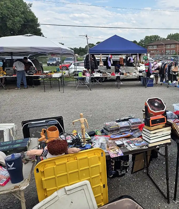 Tables laden with possibilities under summer skies! One person's castoffs become another's conversation pieces in this community treasure hunt.