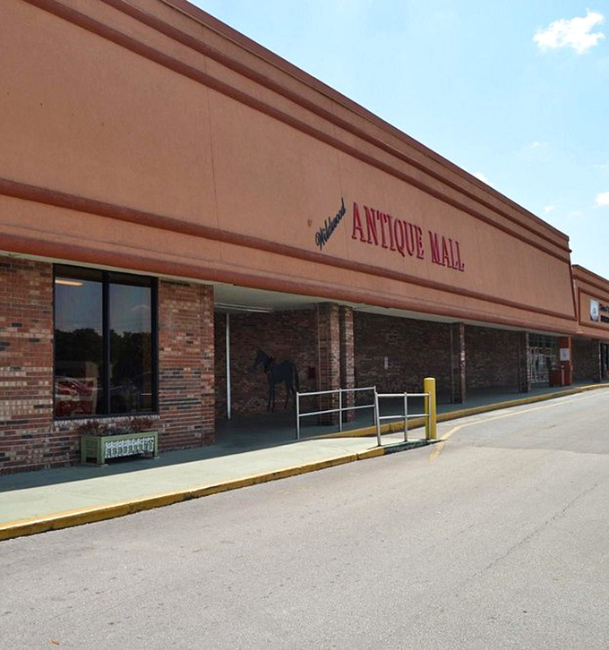 Wildwood Antique Mall's brick-accented entrance – the portal to a world where "they don't make 'em like they used to" isn't just a saying.
