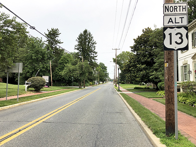 Route 13 cuts through small towns where history whispers from every storefront. No GPS needed—just follow the stories.