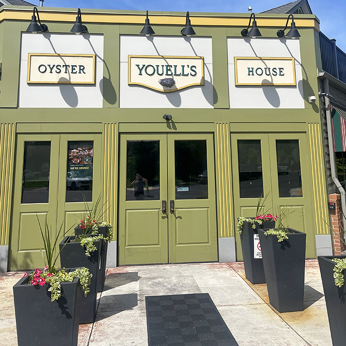 Youell's Oyster House glows a distinctive olive-green, like a jewel box protecting treasures from the sea inside.