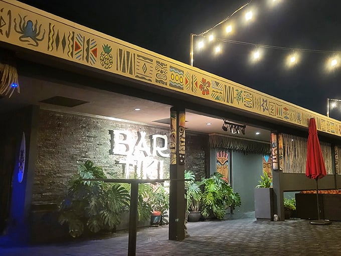 When night falls, Bar Tiki's exterior lights up like a tropical Christmas, promising island flavors that'll make you forget you're in Clearwater.