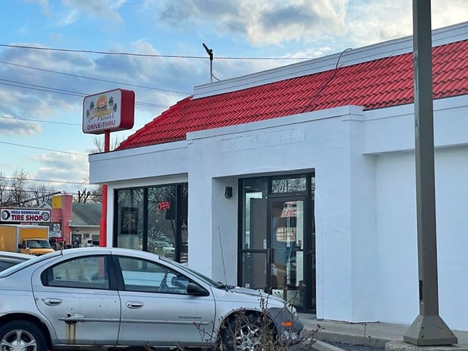 The classic drive-thru with its bright red roof – where burger traditions are honored and appetites are satisfied.