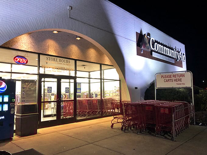 Night or day, Community Aid's welcoming storefront promises bargains galore. Those red shopping carts are about to hold some serious treasures.